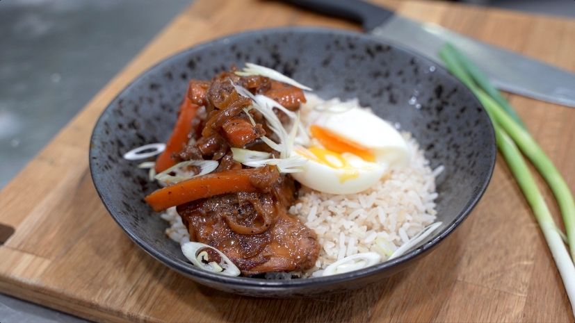 Adobo bowl served over rice with soft boiled egg - Bidfood
